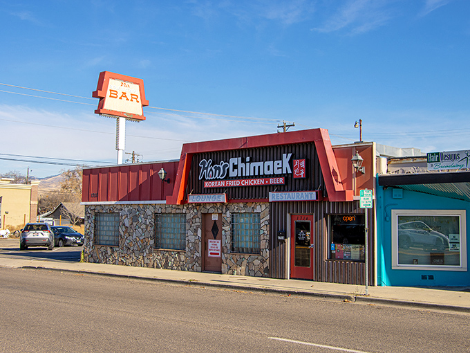 Welcome to chicken paradise! Han's Chimaek's bold red awning and stone facade promise a flavor explosion waiting inside. 