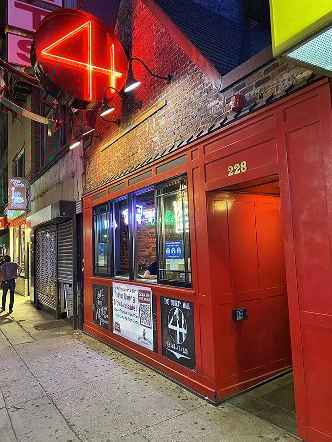 A neon beacon in the night, 4th Wall's red door beckons like a culinary Bat-Signal. Who needs the Batcave when you've got this?
