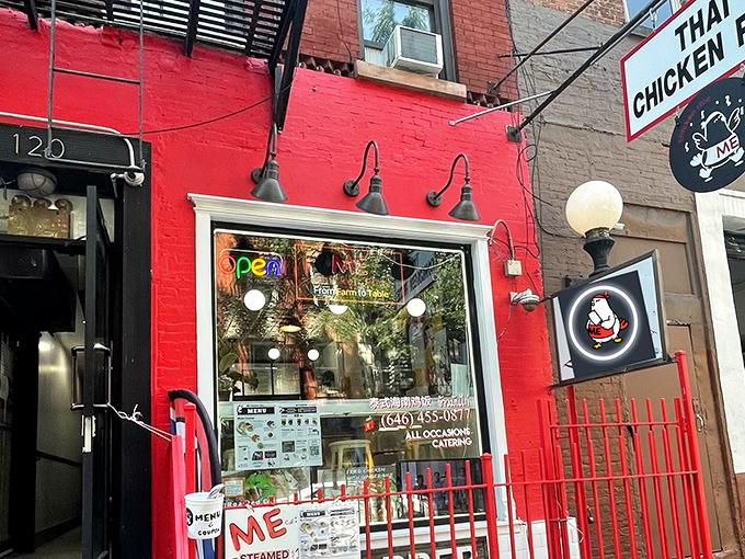 A splash of red in the urban jungle! This vibrant storefront promises a chicken adventure that'll ruffle your feathers in the best way possible.