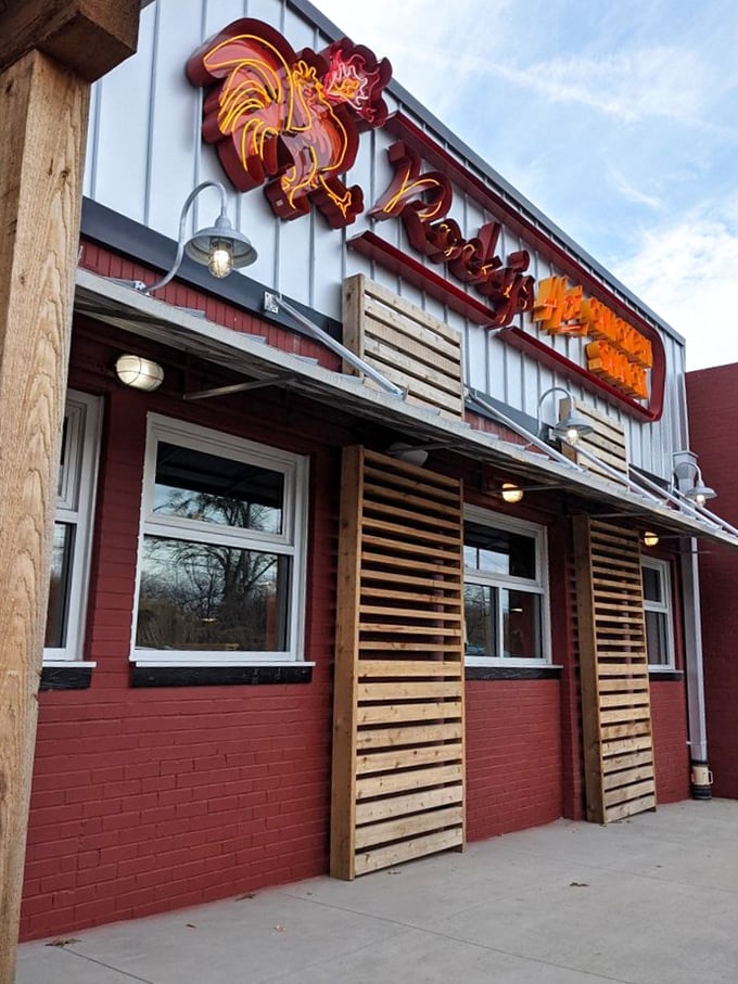A fiery rooster guards the entrance, promising a clucking good time. Rocky's Hot Chicken Shack's exterior is as inviting as a Southern front porch on a summer evening.