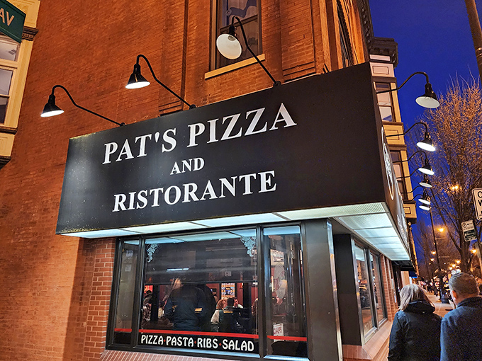 "Welcome to pizza paradise!" Pat's Pizza and Ristorante beckons with its classic neon sign, promising a slice of Chicago history and a whole lot of cheesy goodness.
