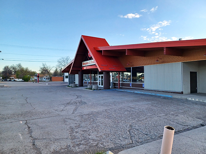 Welcome to the Bargain Bonanza! This red-roofed wonderland is where your wallet breathes a sigh of relief and your inner treasure hunter does a happy dance.