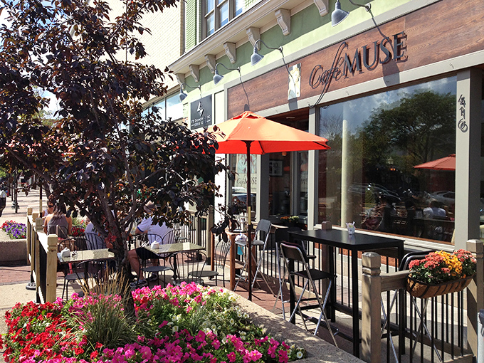 Welcome to cheese paradise! Café Muse's charming exterior promises a cozy retreat where culinary dreams come true.