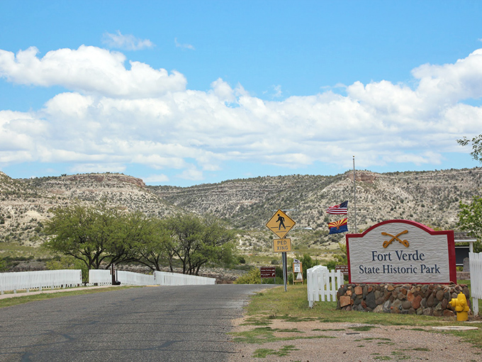 Welcome to Fort Verde: Where the Wild West meets your weekend plans! This unassuming entrance hides a treasure trove of history, just waiting for curious explorers.