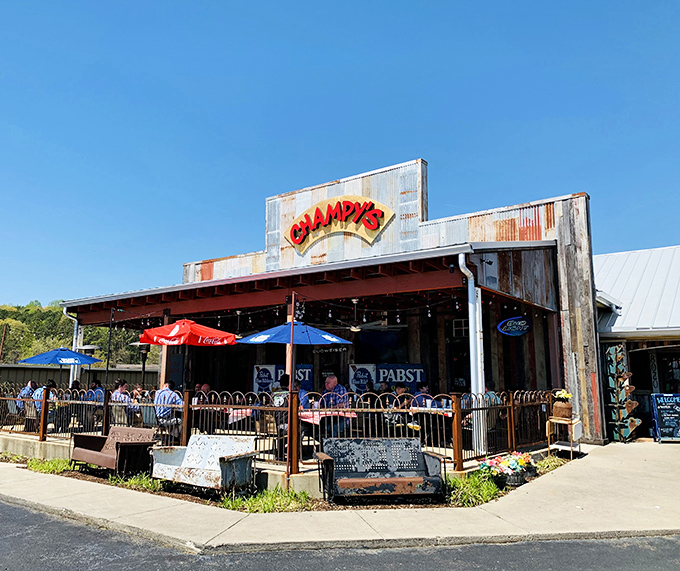 Rustic charm meets Southern hospitality! Champy's exterior beckons with its weathered wood, twinkling lights, and promise of finger-lickin' goodness inside.