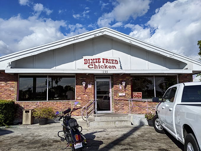 Welcome to chicken paradise! Dixie Fried Chicken's unassuming exterior hides a world of crispy, juicy delights. It's like finding the Holy Grail of comfort food in Belle Glade.