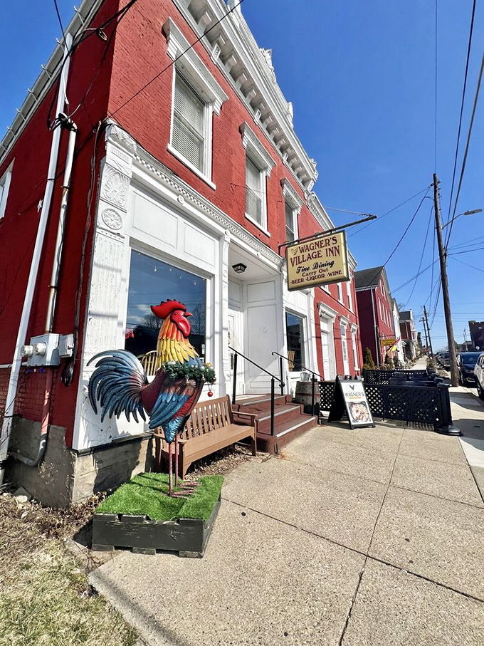 Step into a time warp! This red brick beauty, complete with a technicolor rooster, is like Norman Rockwell's dream come to life.