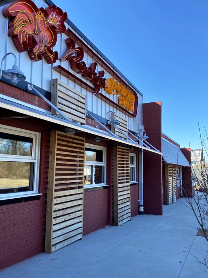 A fiery rooster guards the entrance, promising a clucking good time. Rocky's Hot Chicken Shack's exterior is as inviting as a Southern front porch on a summer evening.