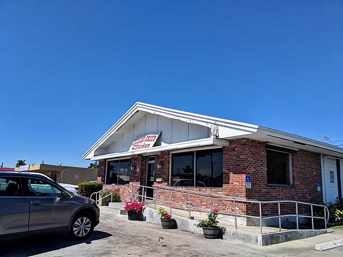 Welcome to chicken paradise! Dixie Fried Chicken's unassuming exterior hides a world of crispy, juicy delights. It's like finding the Holy Grail of comfort food in Belle Glade.