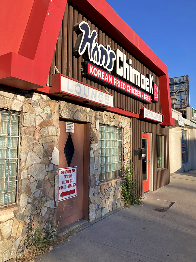 Welcome to chicken paradise! Han's Chimaek's bold red awning and stone facade promise a flavor explosion waiting inside.