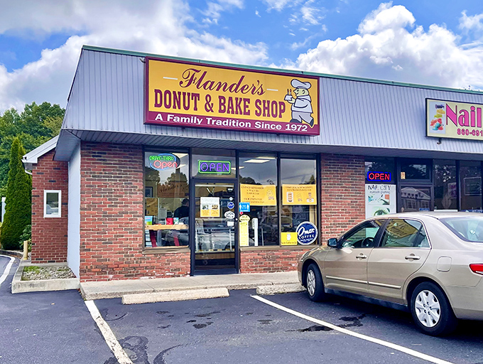 Welcome to donut paradise! Flanders Donut & Bake Shop's cheery yellow sign promises a family tradition of sweet delights since 1972. 