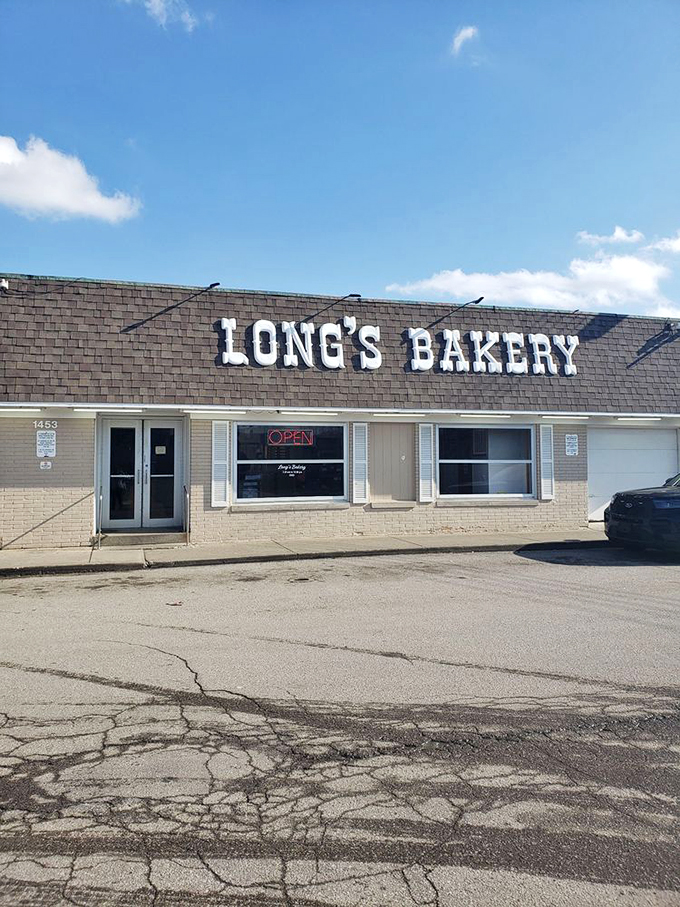 Welcome to donut paradise! Long's Bakery stands proud, its no-frills exterior promising sweet delights within. It's like the Clark Kent of bakeries - unassuming, but hiding superpowers.