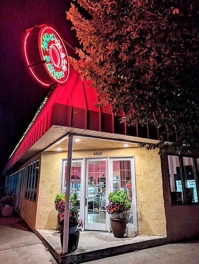 A yellow beacon of sugary salvation! Mel-O-Glaze Bakery stands unassumingly on the corner, its retro sign promising sweet delights within. It's like stumbling upon Willy Wonka's secret Midwest outpost.