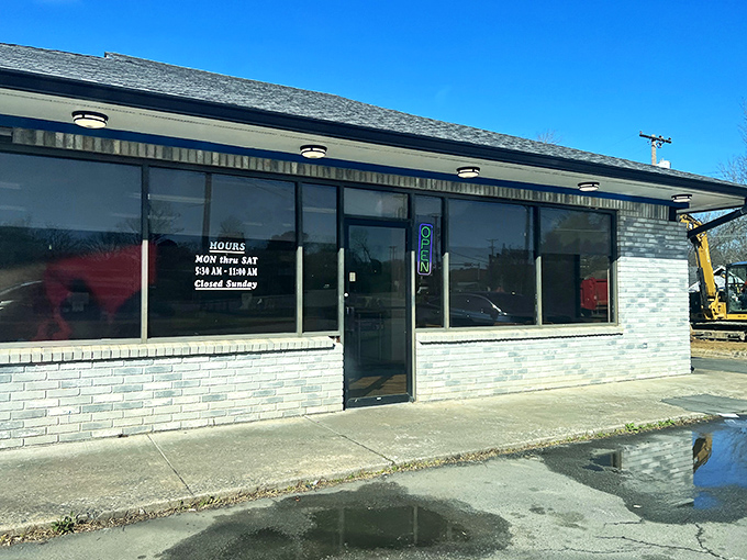 A humble brick facade hides a world of sugary wonders. Mark's Do-Nut Shop: where dreams come glazed, frosted, and filled.