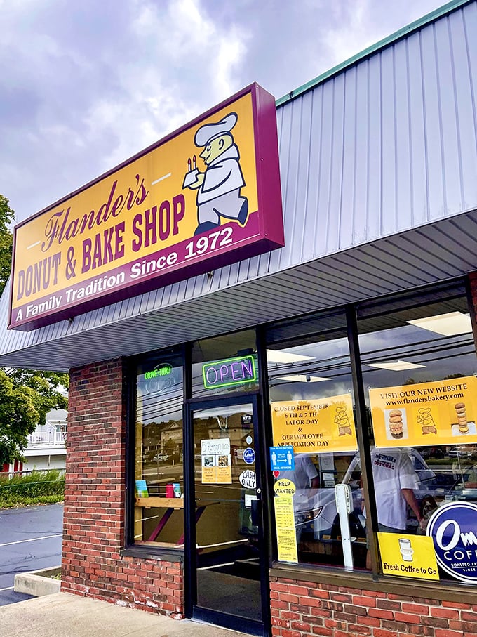 Welcome to donut paradise! Flanders Donut & Bake Shop's cheery yellow sign promises a family tradition of sweet delights since 1972.