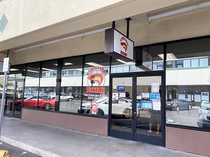 Welcome to donut paradise! Kamehameha Bakery's unassuming exterior hides a world of sugary delights that would make Homer Simpson weep with joy.