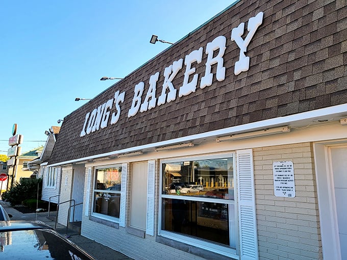Welcome to donut paradise! Long's Bakery stands proud, its no-frills exterior promising sweet delights within. It's like the Clark Kent of bakeries - unassuming, but hiding superpowers.