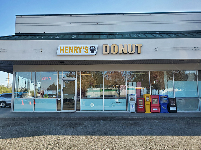 Welcome to donut paradise! Henry's Donut stands proud against the Washington sky, promising sweet delights within its unassuming exterior.