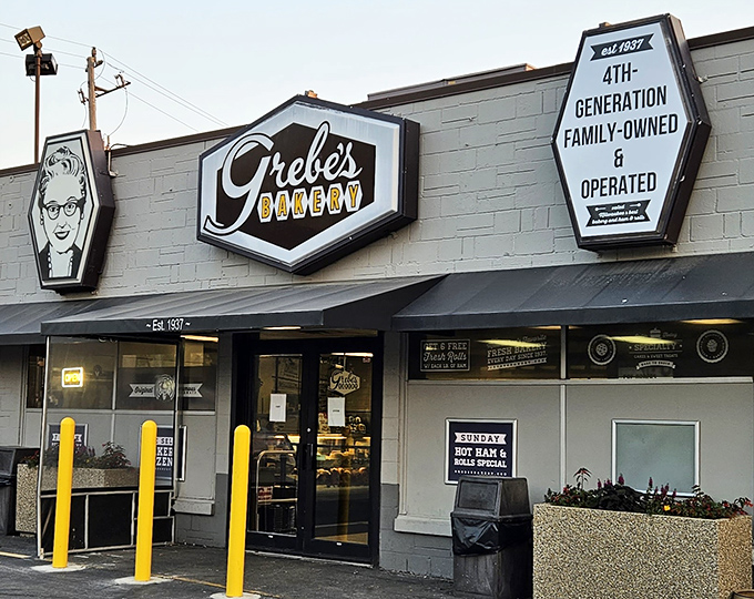 Welcome to carb heaven! Grebe's Bakery's retro sign beckons like a sugary siren, promising delights that would make even the Pillsbury Doughboy jealous.