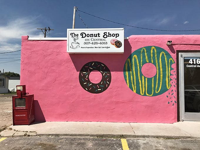 A pink paradise that's more eye-catching than a rodeo clown! This donut shop's exterior is a delightful feast for the eyes and a promise of sweet treats within.