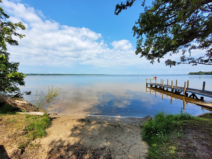 Nature's welcome mat: A sandy shore meets lush greenery, inviting you to kick off your shoes and stay awhile. Who needs a red carpet when you've got this golden beach?