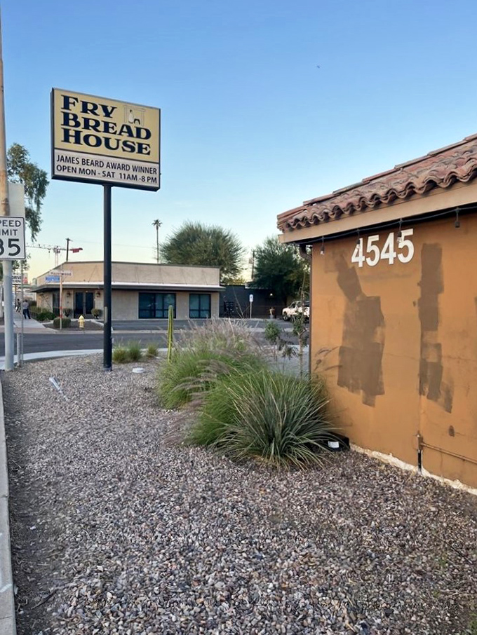 Welcome to carb heaven! The Fry Bread House sign beckons like a siren song, promising James Beard Award-winning delights under the Arizona sky.