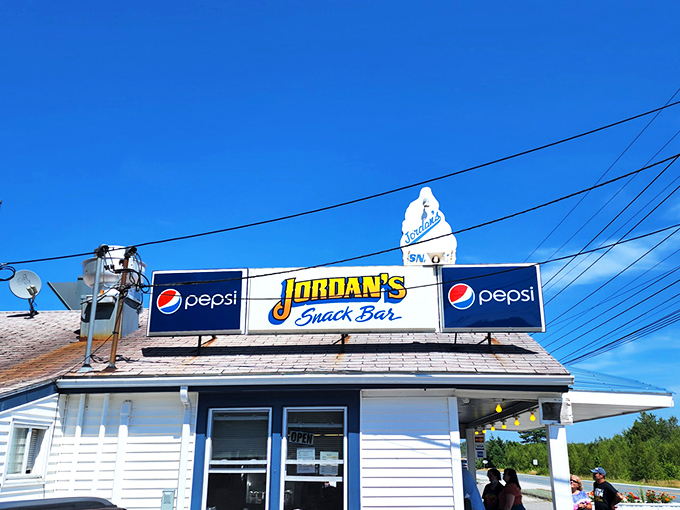 A slice of Americana with a side of seafood! Jordan's Snack Bar beckons with its classic white exterior and promise of lobster-filled dreams.