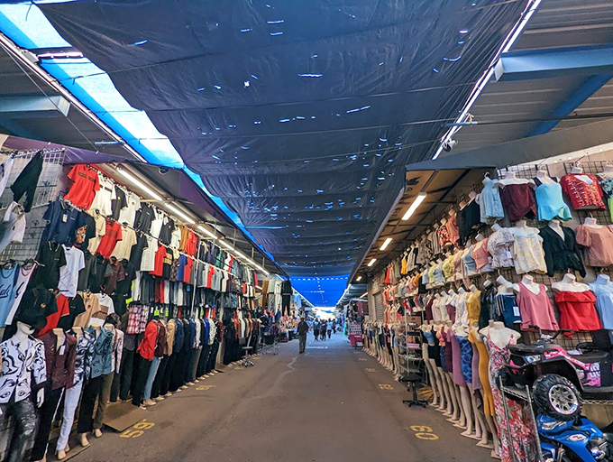Step into a bargain hunter's paradise! This clothing corridor stretches as far as the eye can see, like a fashionista's Field of Dreams.