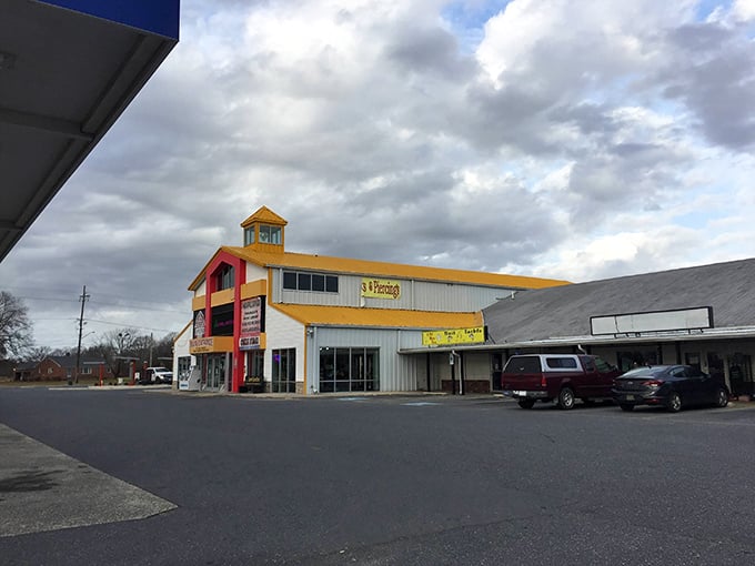 Welcome to bargain hunter's paradise! Laurel Junction Flea Market's colorful exterior promises a treasure trove of finds inside. It's like Aladdin's cave, but with better parking.