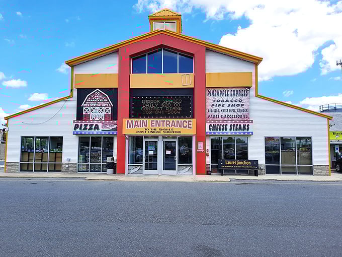 Welcome to bargain hunter's paradise! Laurel Junction Flea Market's colorful exterior promises a treasure trove of finds inside. It's like Aladdin's cave, but with better parking.