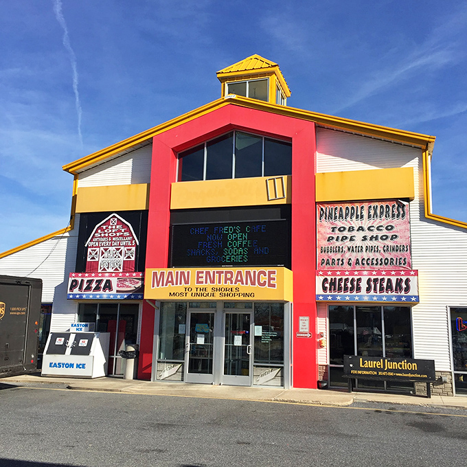 Welcome to bargain hunter's paradise! Laurel Junction Flea Market's colorful exterior promises a treasure trove of finds inside. It's like Aladdin's cave, but with better parking.