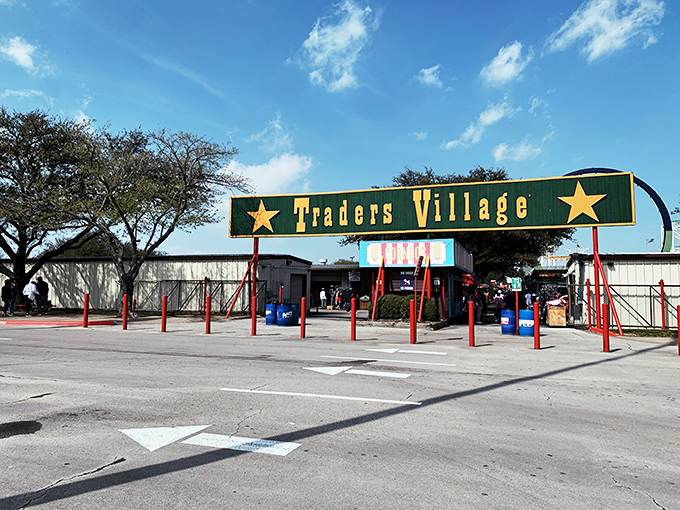 Welcome to bargain hunter's paradise! Traders Village's iconic green and yellow entrance beckons shoppers to a world of treasures and treats.