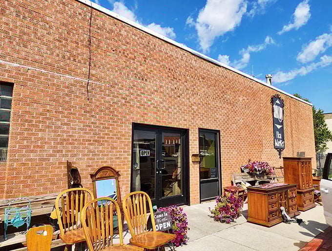 Step right up, folks! This brick behemoth isn't just a building; it's a portal to treasure-hunting paradise. The "FLEA MARKET" sign practically winks at you, promising adventures in antiquing.