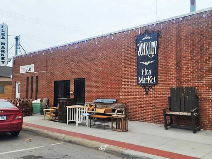 Step right up, folks! This brick behemoth isn't just a building; it's a portal to treasure-hunting paradise. The "FLEA MARKET" sign practically winks at you, promising adventures in antiquing.