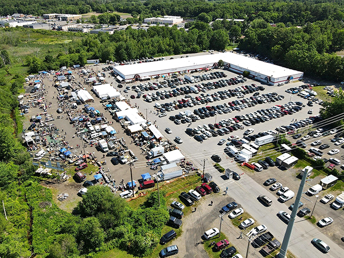 Welcome to bargain hunter's paradise! This aerial view of Salem NH Flea Market Inc showcases a sprawling wonderland where treasure seekers flock to unearth hidden gems and quirky finds.