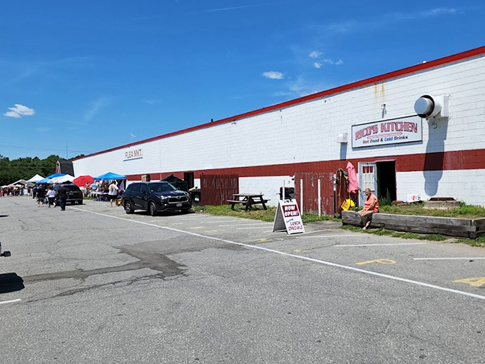Welcome to bargain hunter's paradise! The Salem NH Flea Market Inc stretches as far as the eye can see, with colorful tents and a packed parking lot promising treasures galore for eager shoppers.
