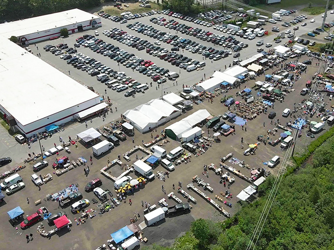 Welcome to bargain hunter's paradise! This aerial view of Salem NH Flea Market Inc showcases a sprawling wonderland where treasure seekers flock to unearth hidden gems and quirky finds.