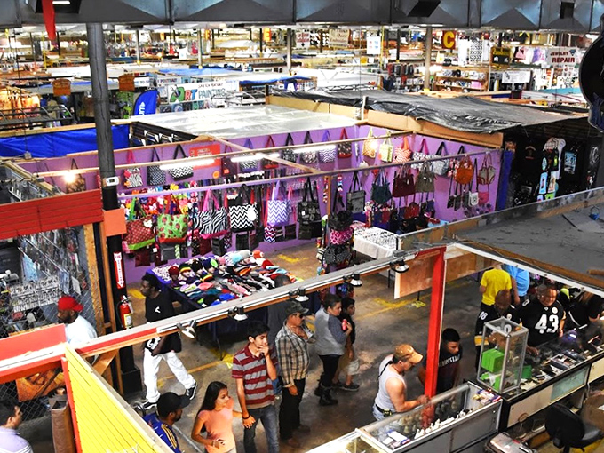 Step right up to the carnival of commerce! This flea market aisle is a kaleidoscope of neon signs, cowboy hats, and endless possibilities.