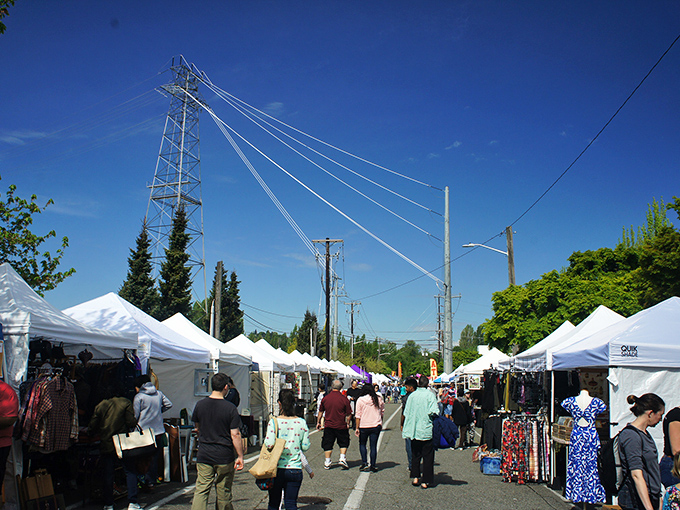 Welcome to treasure hunter's paradise! The Fremont Sunday Street Market transforms Seattle's quirkiest neighborhood into a wonderland of white tents and endless possibilities.