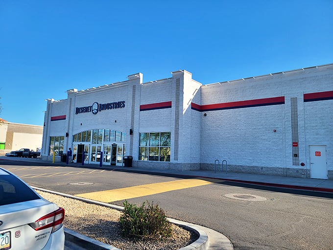 Welcome to the Taj Mahal of thrift stores! Deseret Industries stands proud, a white beacon of bargain-hunting bliss under the azure Arizona sky.