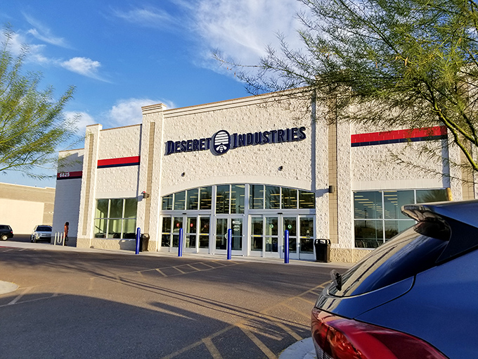 Welcome to the Taj Mahal of thrift stores! Deseret Industries stands proud, a white beacon of bargain-hunting bliss under the azure Arizona sky.