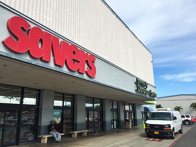 Welcome to bargain paradise! Savers' exterior promises a treasure trove of deals, nestled between palm trees and parked cars. It's like a retail oasis in the urban jungle.