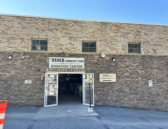 Welcome to The Ranch, where bargain hunting meets adventure! This rustic exterior promises treasures within, like a thrift store disguised as a frontier outpost.