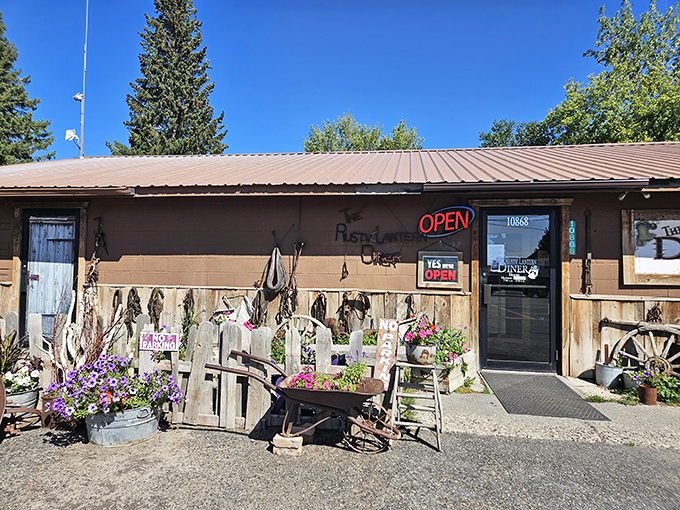 elcome to the Rusty Lantern Diner, where charm is served in heaping portions! This quaint exterior, adorned with colorful flowers, promises a feast for both eyes and stomach.