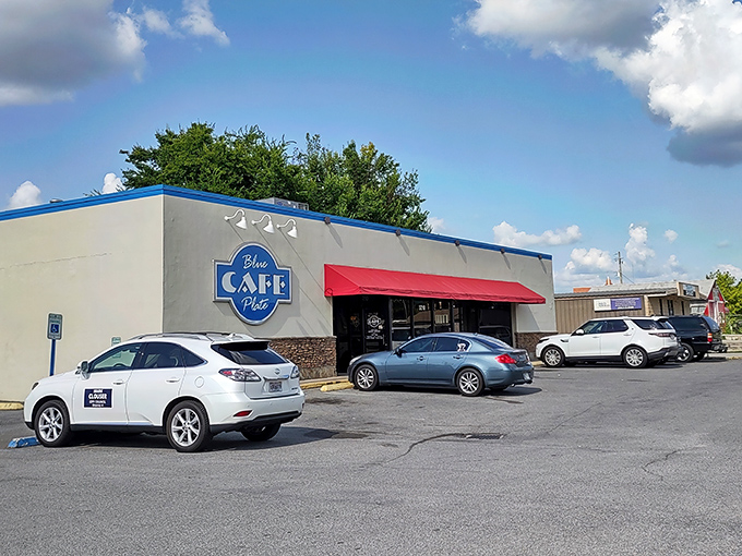 A blue-trimmed beacon of breakfast bliss! This unassuming exterior hides a treasure trove of Southern comfort food that'll make your taste buds dance.