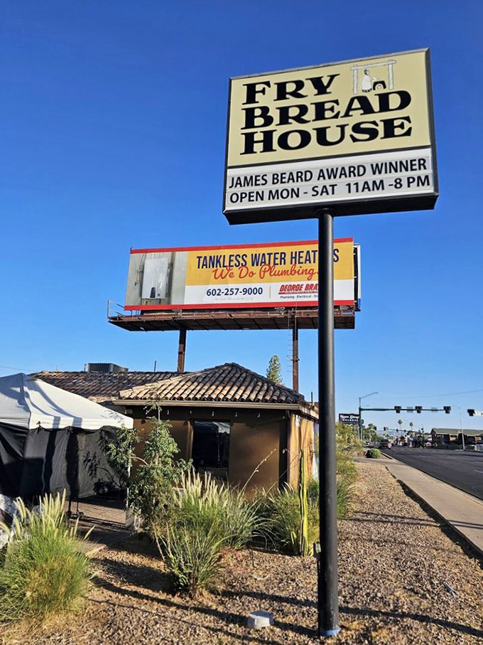 Welcome to carb heaven! The Fry Bread House sign beckons like a siren song, promising James Beard Award-winning delights under the Arizona sky.