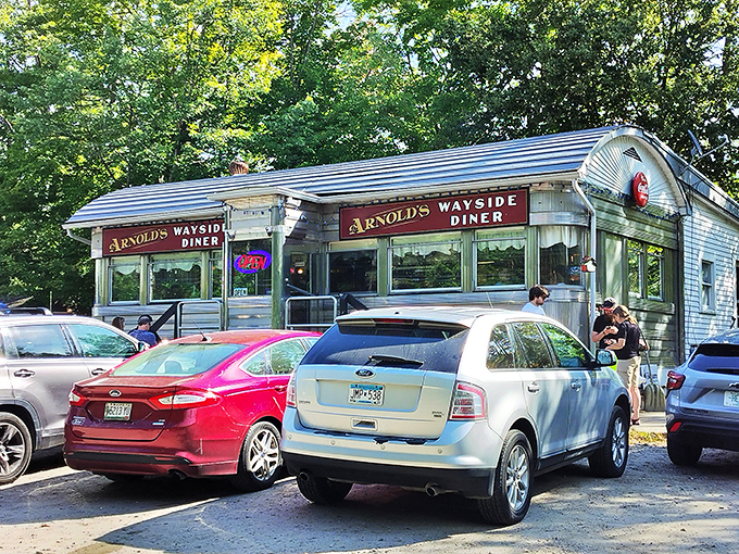 A time capsule on wheels! Arnold's Wayside Diner sits pretty amidst autumn foliage, promising a feast for both eyes and stomach.