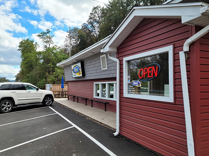Welcome to flavor town! This cozy red exterior isn't just a diner, it's a portal to comfort food paradise.