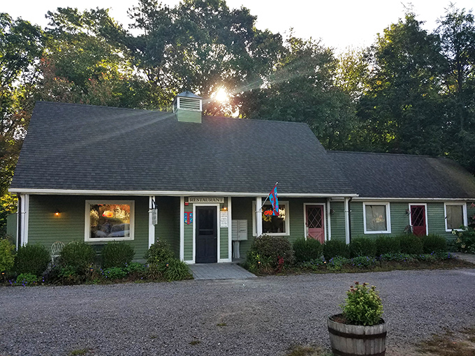 A cozy green haven beckons! The Hungry Haven's exterior is like a warm hug from your favorite aunt, complete with charming flower beds and a welcoming atmosphere.