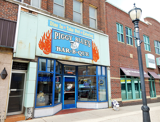 Welcome to Piggy Blue's, where the neon sign is as bright as the flavors inside! This barbecue joint's exterior promises a feast for both your eyes and your taste buds.